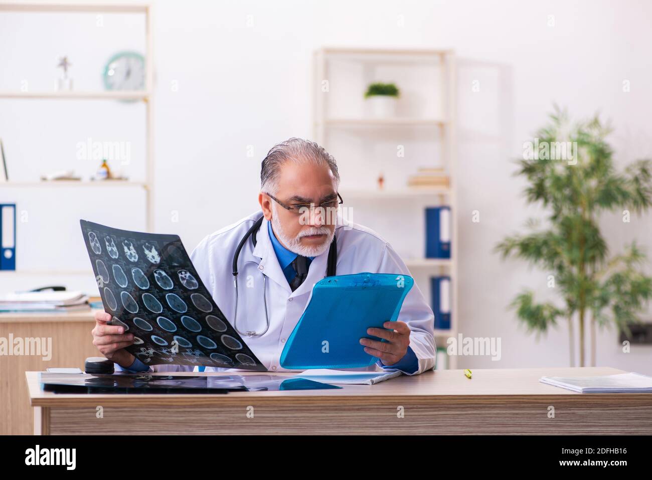 Hospital radiologist checking notes hi-res stock photography and images ...