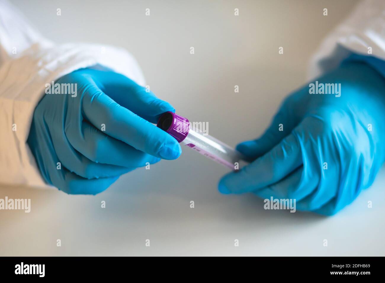 Process of coronavirus testing examination by nurse medic in laboratory ...