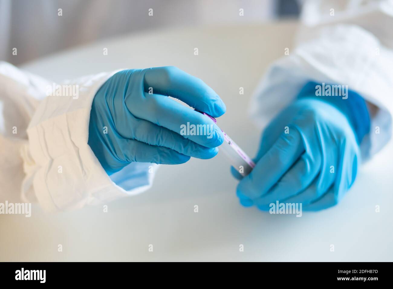 Process of coronavirus testing examination by nurse medic in laboratory ...