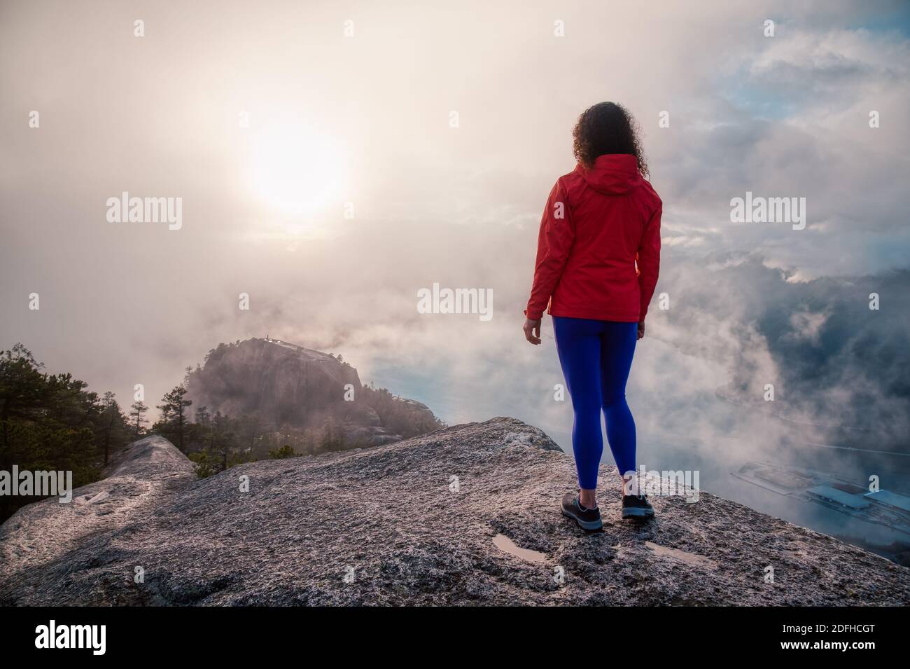 Adventurous Girl Hiking on top of a Peak Stock Photo - Alamy