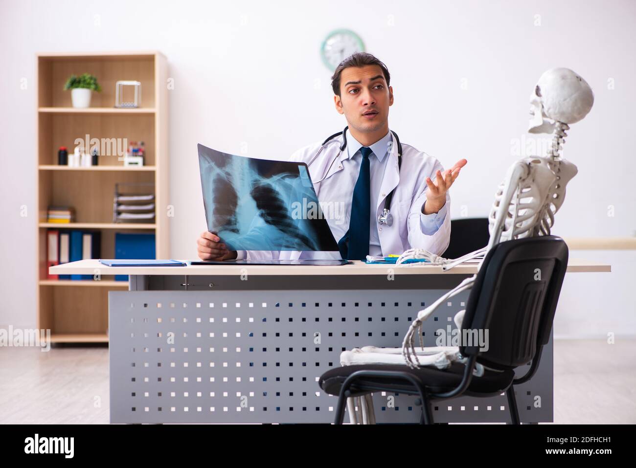 Young doctor radiologist and skeleton patient in the clinic Stock Photo ...