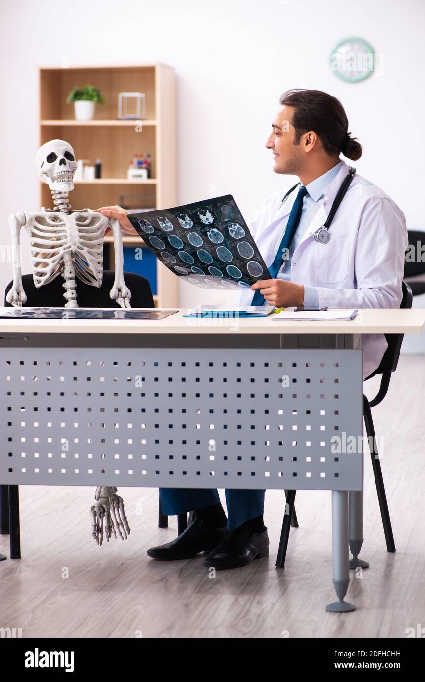 Young doctor radiologist and skeleton patient in the clinic Stock Photo ...