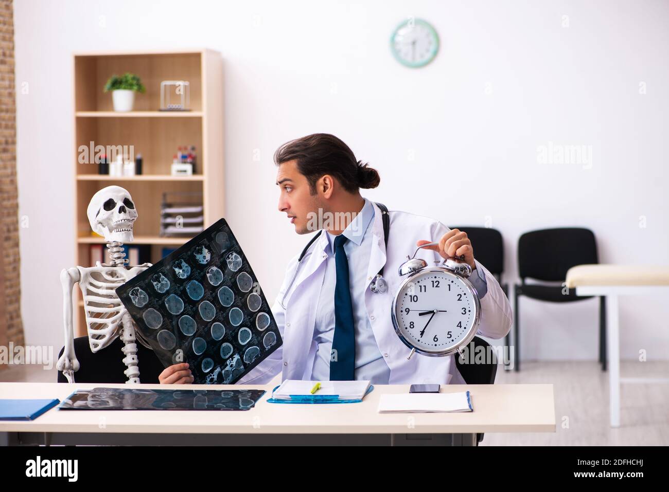 Young doctor radiologist and skeleton patient in the clinic Stock Photo ...