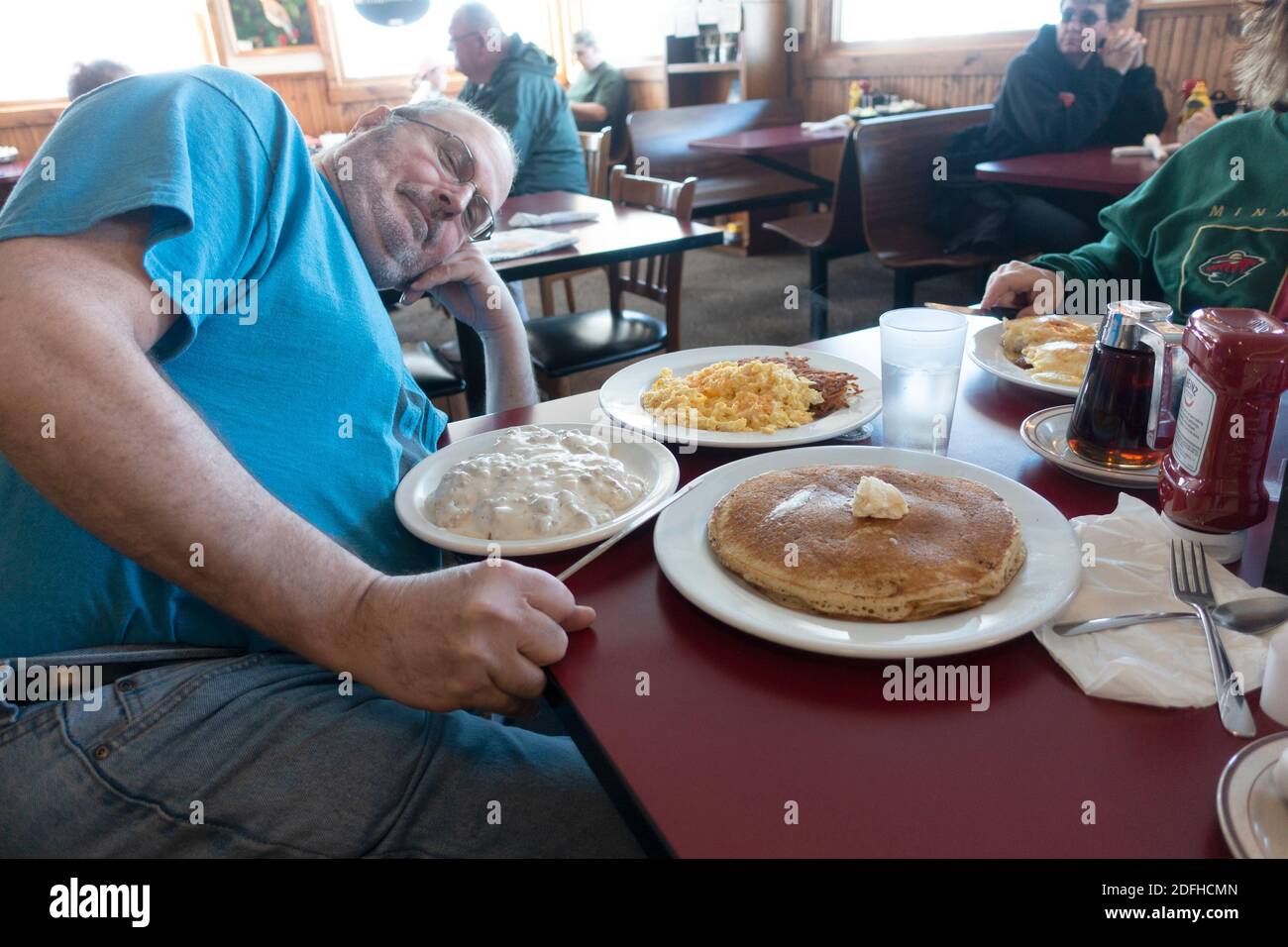 Breakfast pancakes scrambled eggs hash brown grits hi-res stock ...