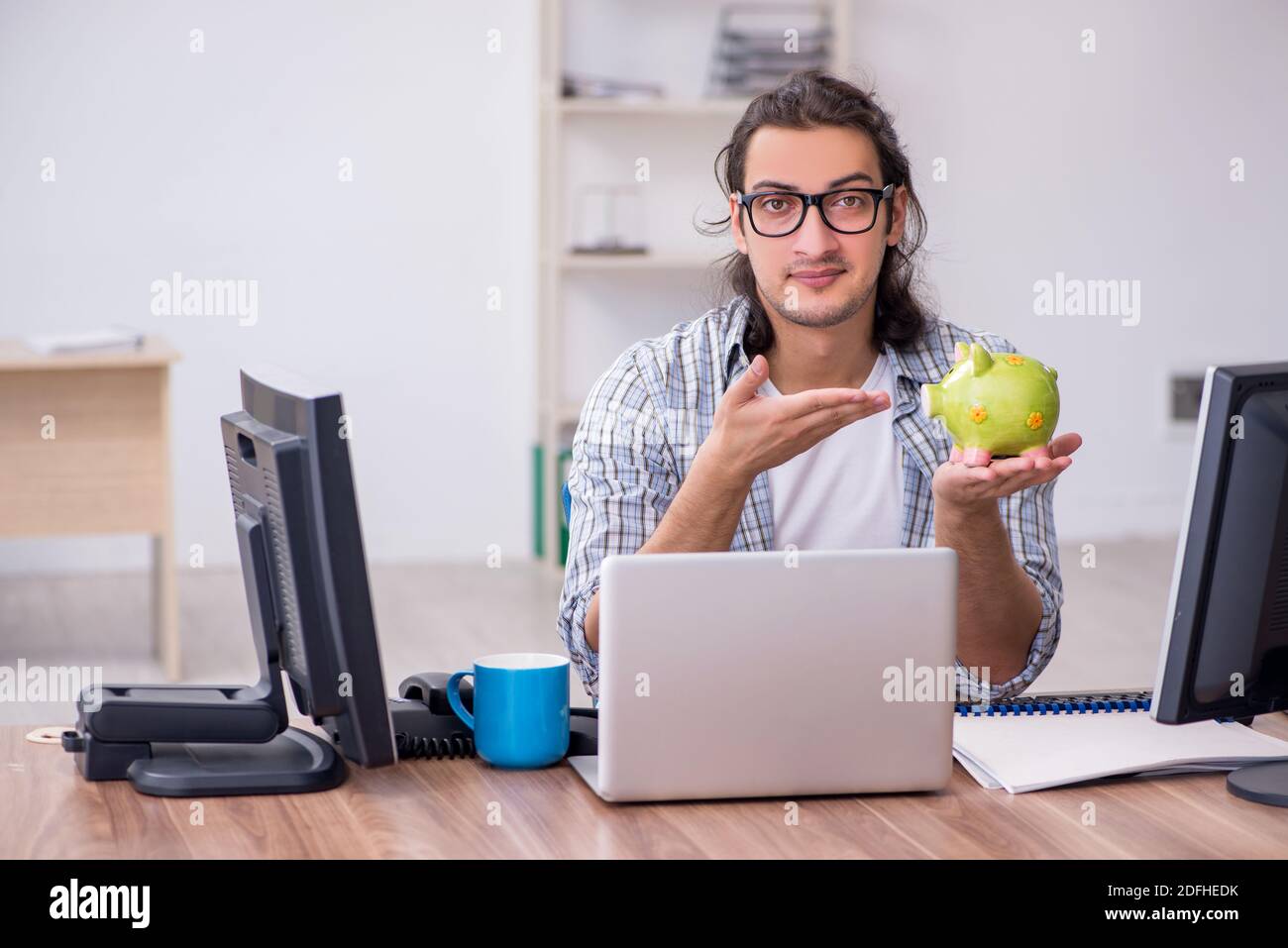 Male it specialist working in the office Stock Photo - Alamy