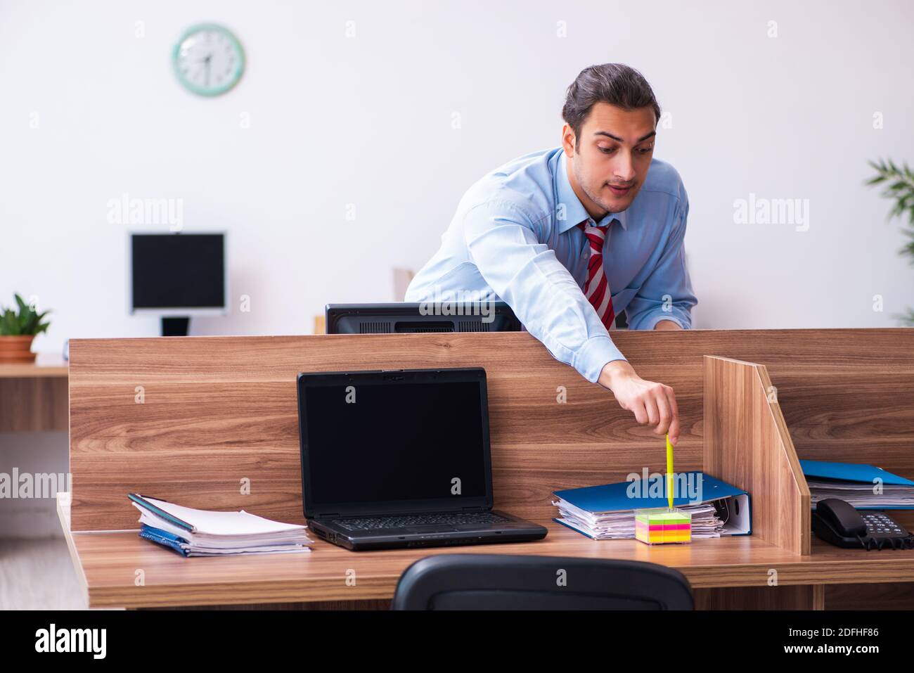 Male employee in industrial espionage concept Stock Photo - Alamy