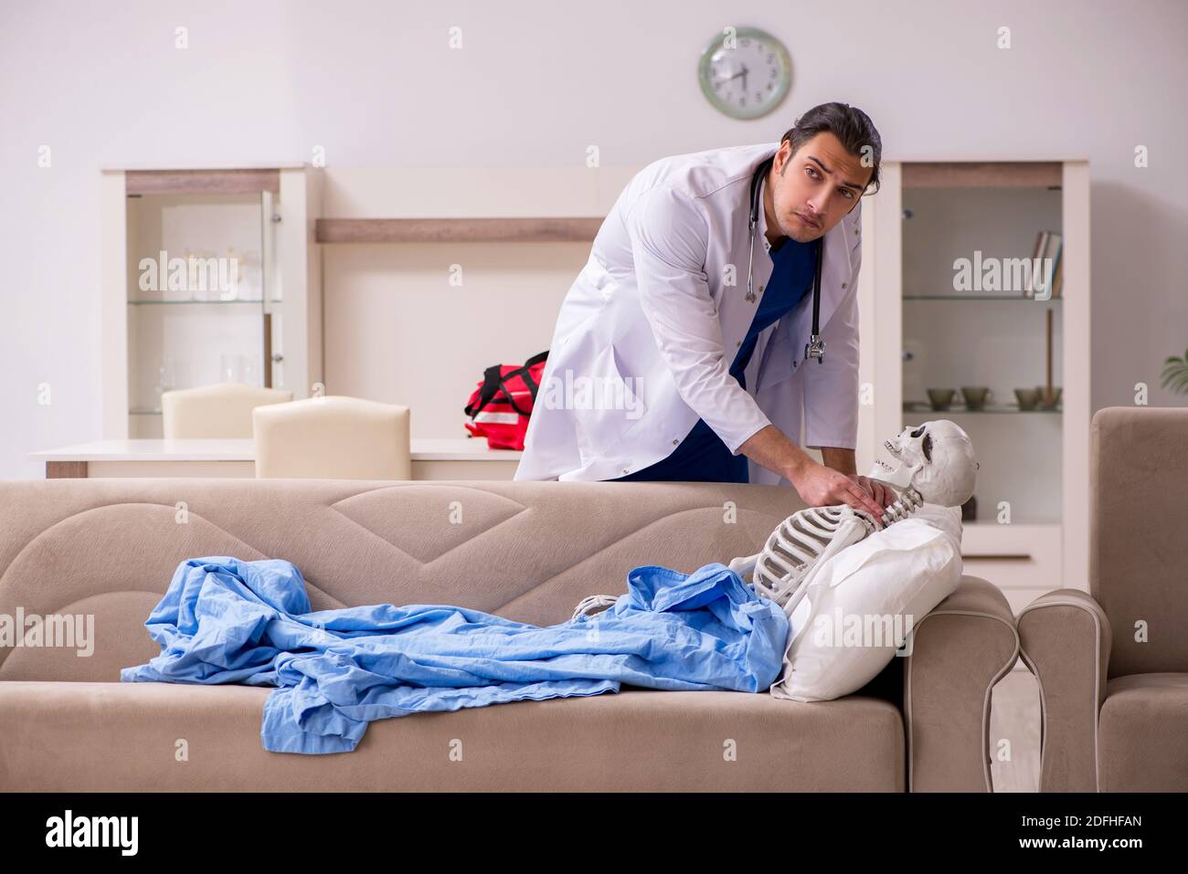 Male paramedic visiting skeleton patient Stock Photo - Alamy