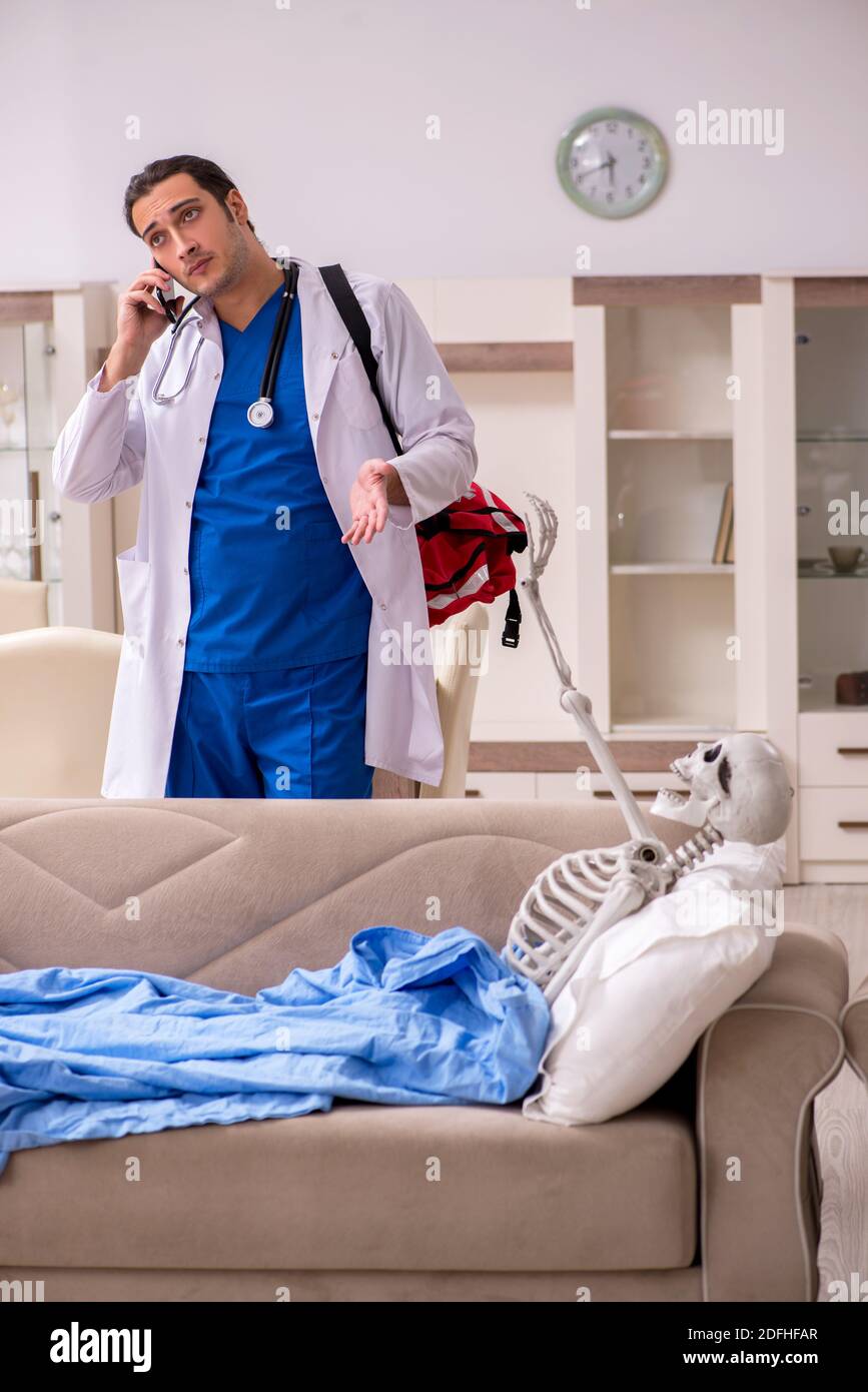Male paramedic visiting skeleton patient Stock Photo - Alamy