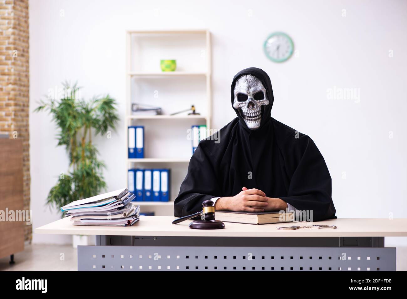 Devil judge working in the courthouse Stock Photo - Alamy