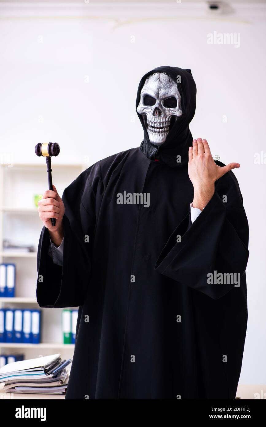 Devil judge working in the courthouse Stock Photo - Alamy