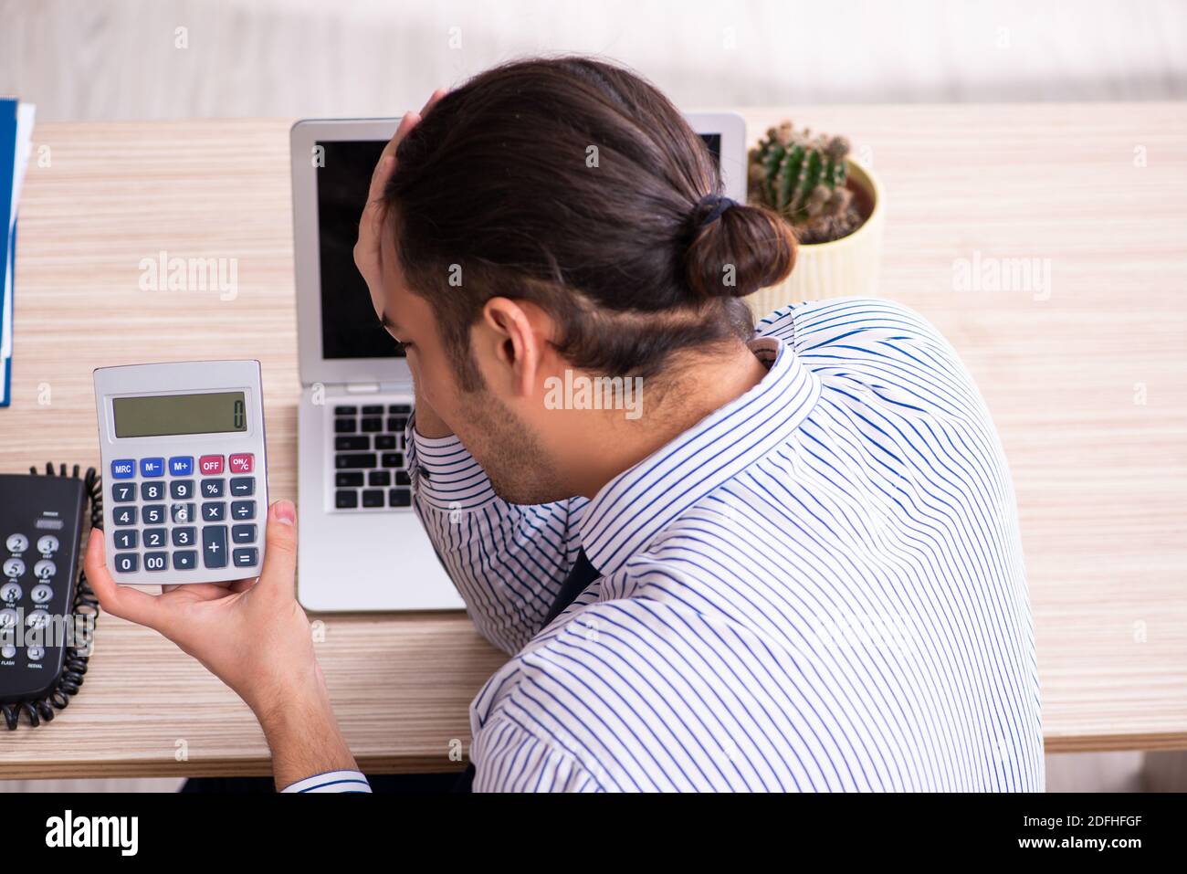 Male accountant in crisis concept Stock Photo - Alamy
