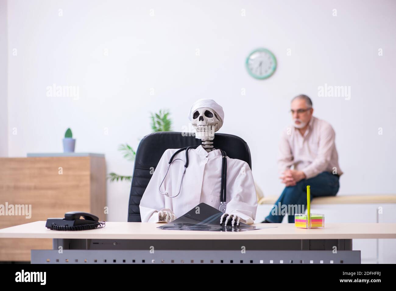Skeleton doctor in funny medical concept Stock Photo - Alamy