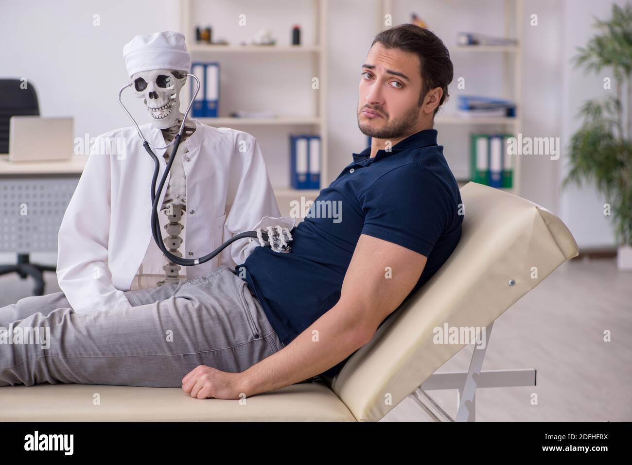 Young man visiting dead doctor in hospital Stock Photo - Alamy
