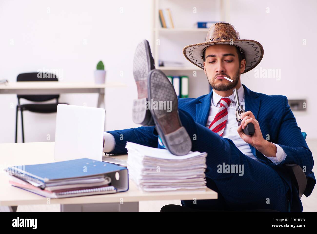 Young cowboy smoking cigarette hi-res stock photography and images - Alamy