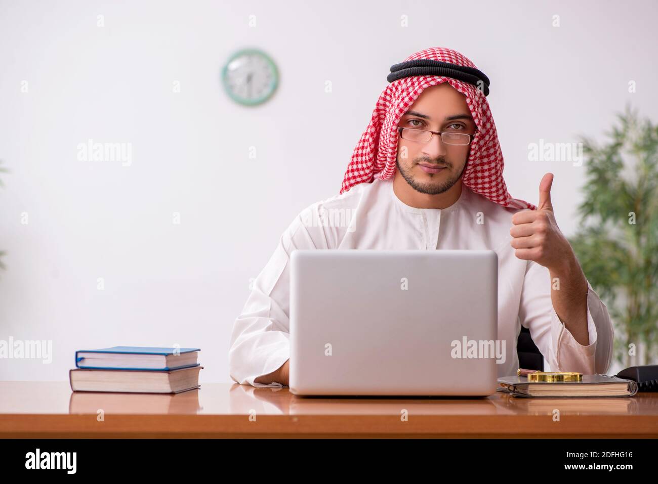 Male arab employee working in the office Stock Photo - Alamy