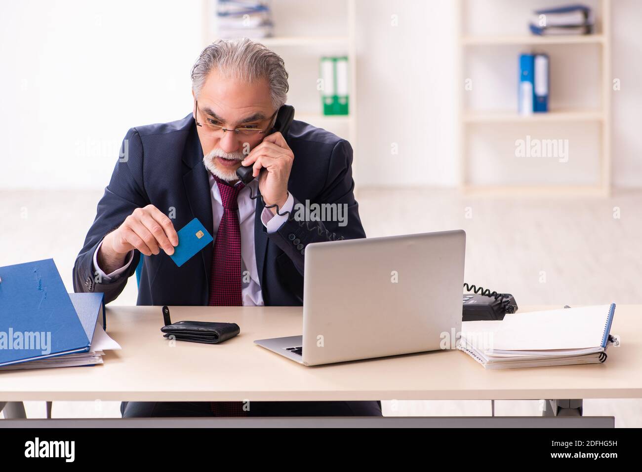 Old businessman in bankruptcy concept Stock Photo - Alamy