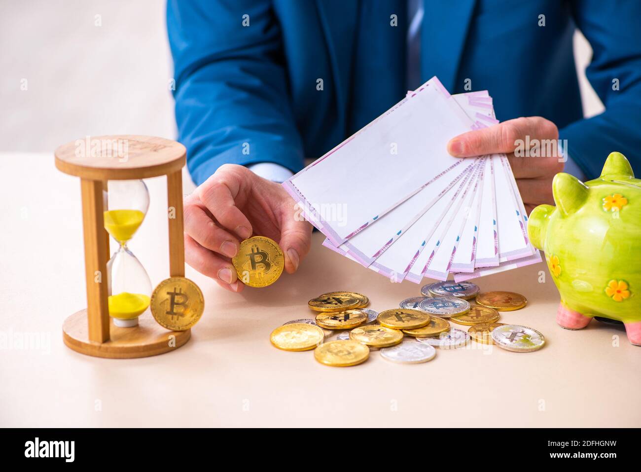 Old man earning money via internet in time management concept Stock ...