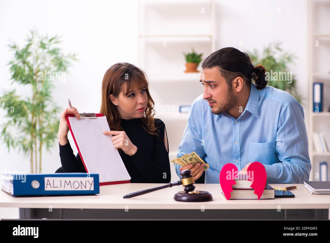 Couple divorcing in alimony concept Stock Photo - Alamy