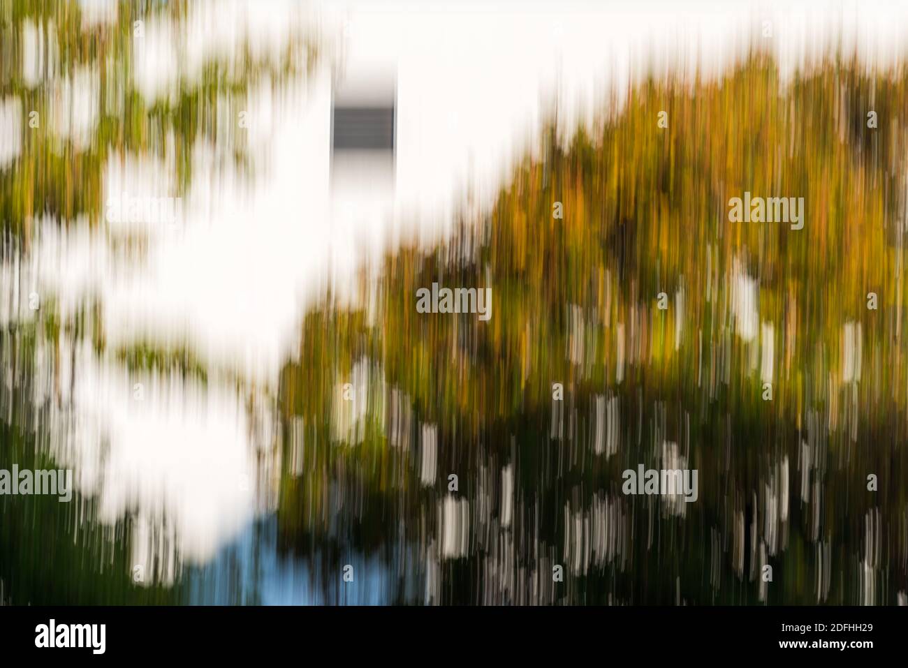 Ventilation shaft in a white facade with blurred trees Stock Photo - Alamy