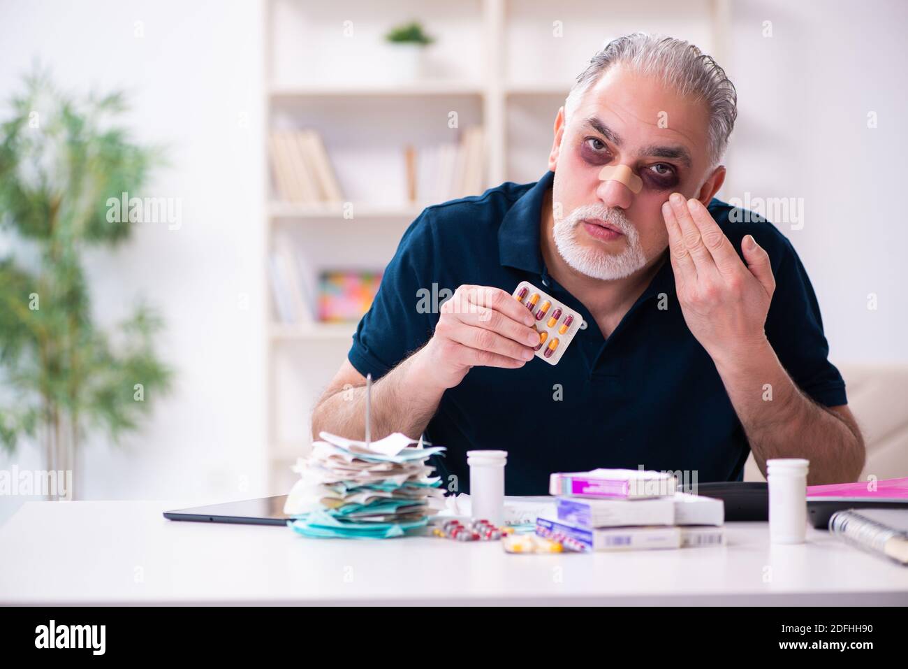 Old man in budget planning concept Stock Photo - Alamy