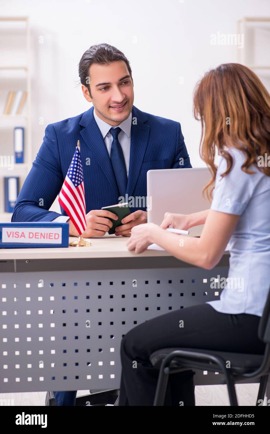 Young woman visiting american embassy for the visa Stock Photo - Alamy