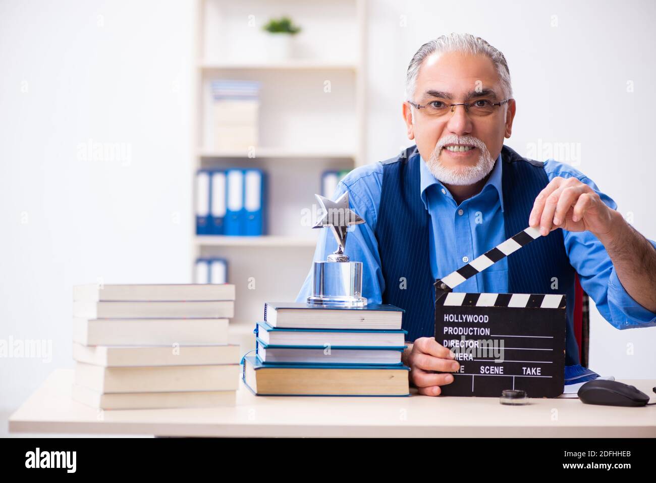 Old male author writing the screenplay Stock Photo - Alamy