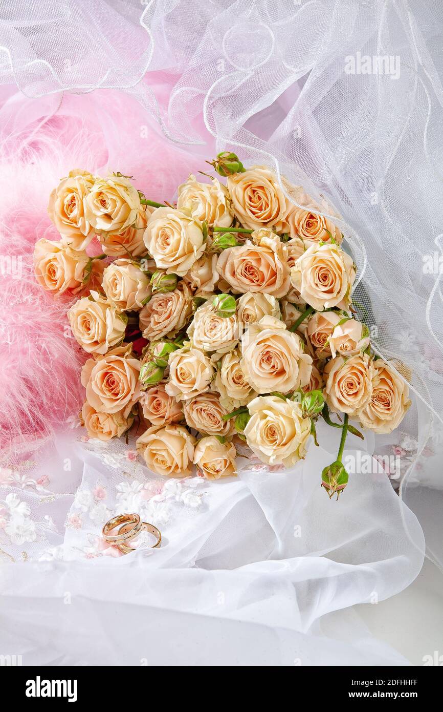 Still life with bouquet of flowers and accessories on a studio ...