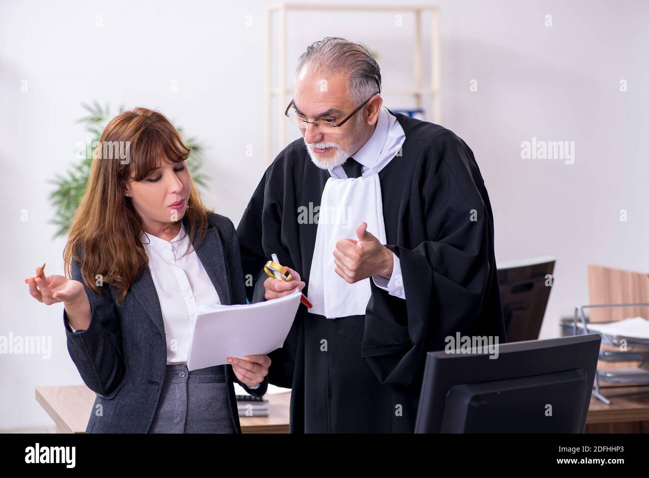 Old judge and his young secretary in the office Stock Photo - Alamy