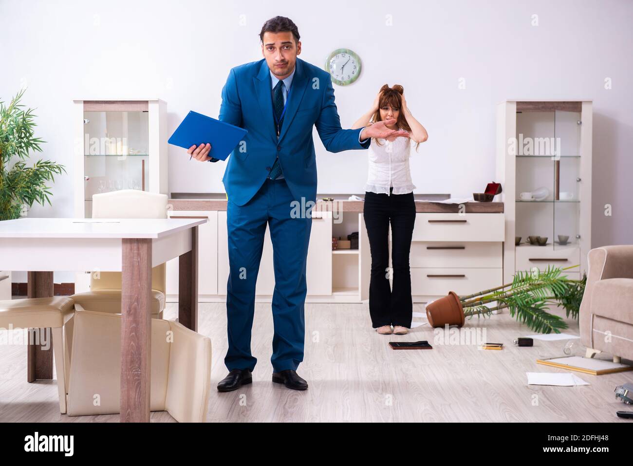 Female owner and police officer in housebreaking concept Stock Photo ...