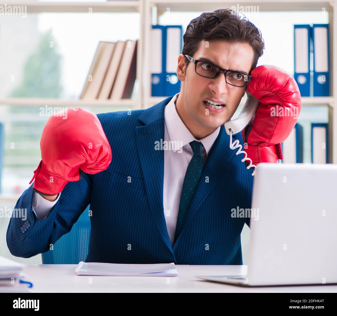 The businessman with boxing gloves angry in office Stock Photo - Alamy