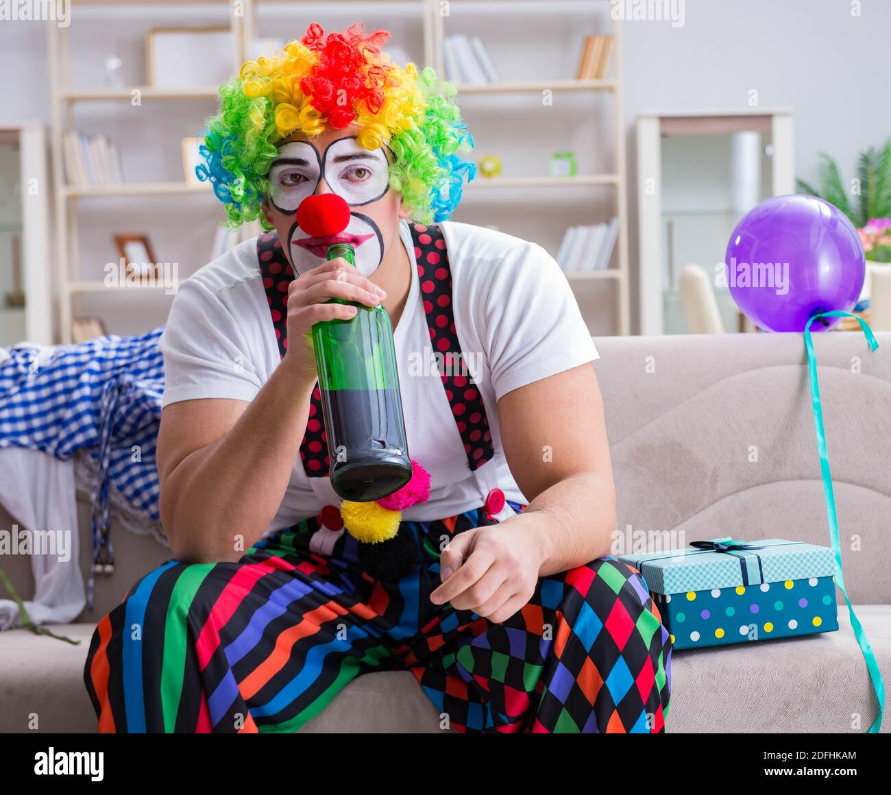 The drunk clown celebrating having a party at home Stock Photo - Alamy