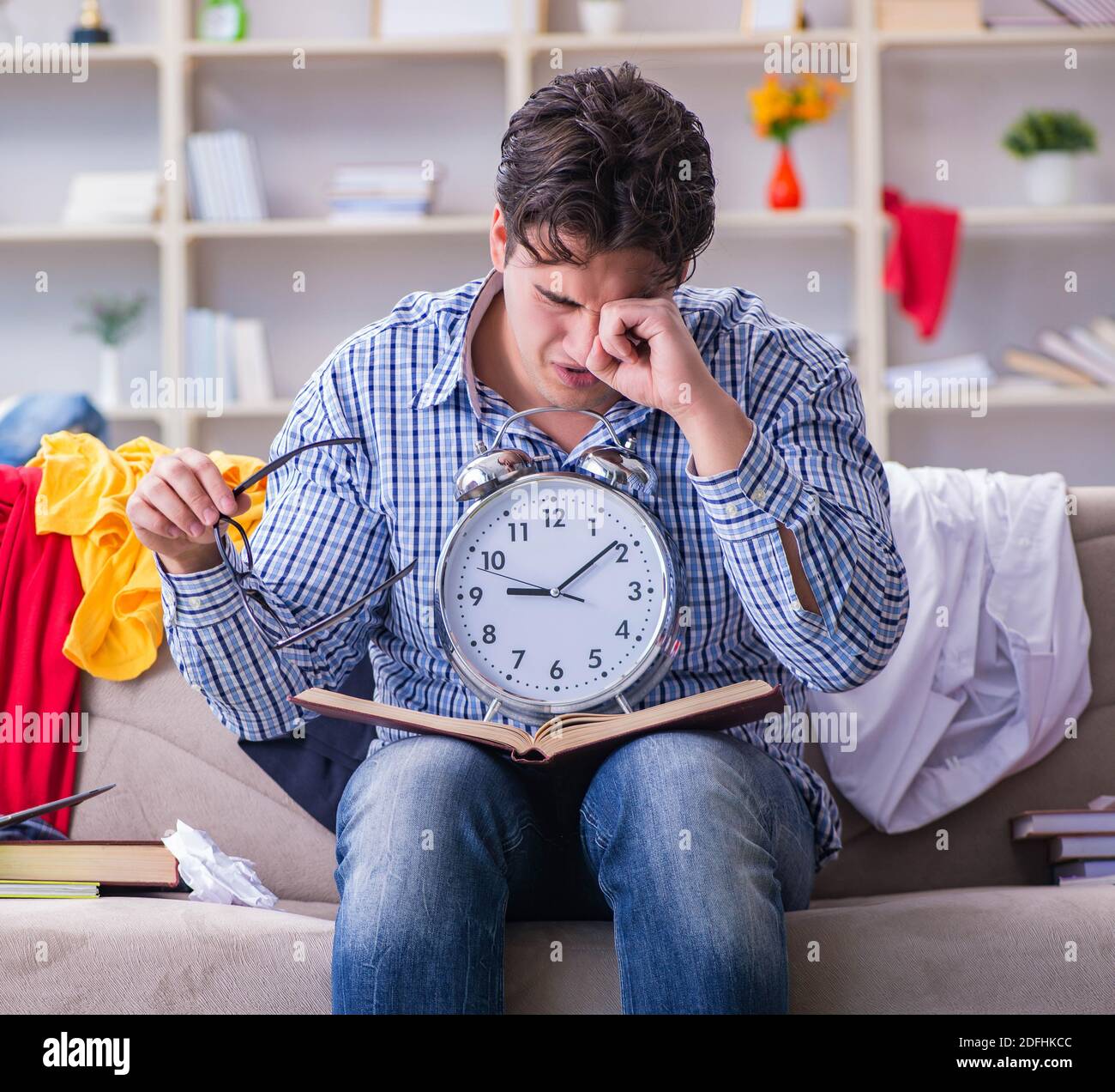 The young man working studying in messy room Stock Photo - Alamy