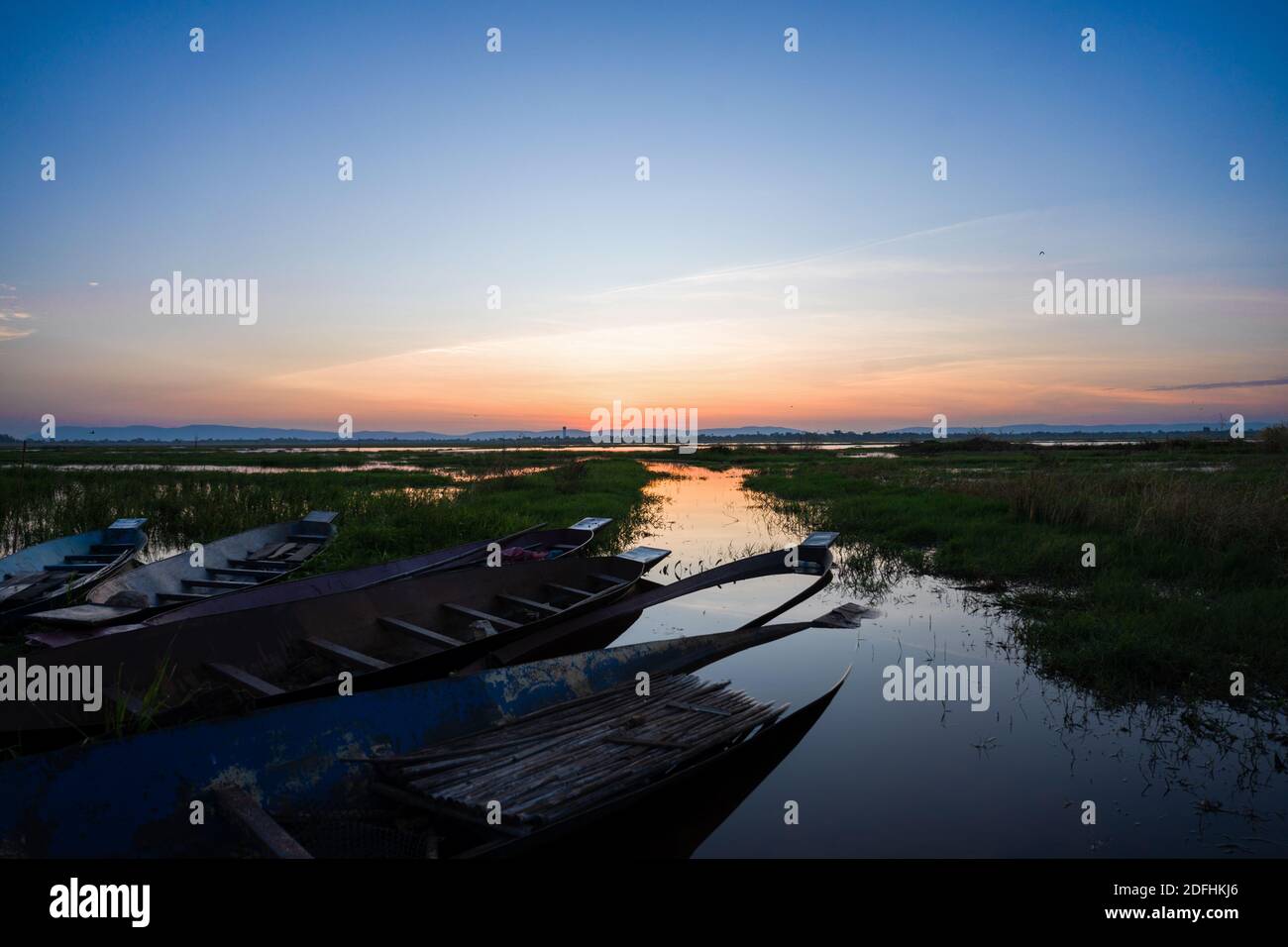 sunrise on small lek with fishing boat Stock Photo - Alamy