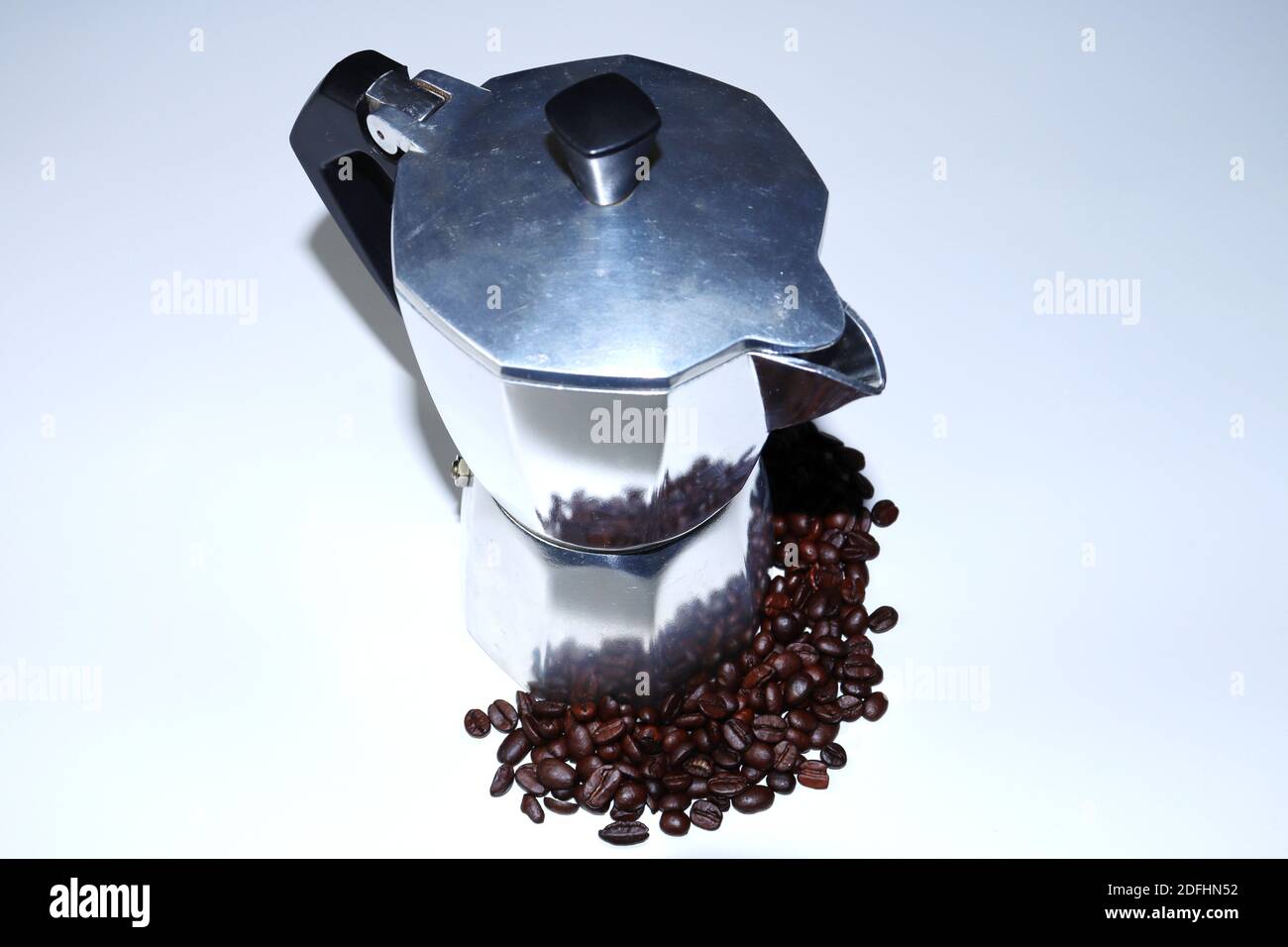 Moka pot with coffee beans on a white background. Moka coffee maker ...