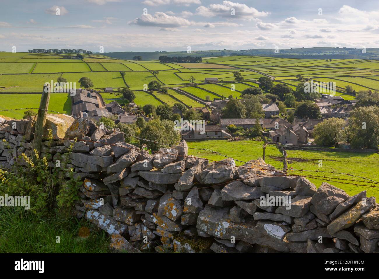 View of dry stone walls and Litton village, Peak District National Park ...