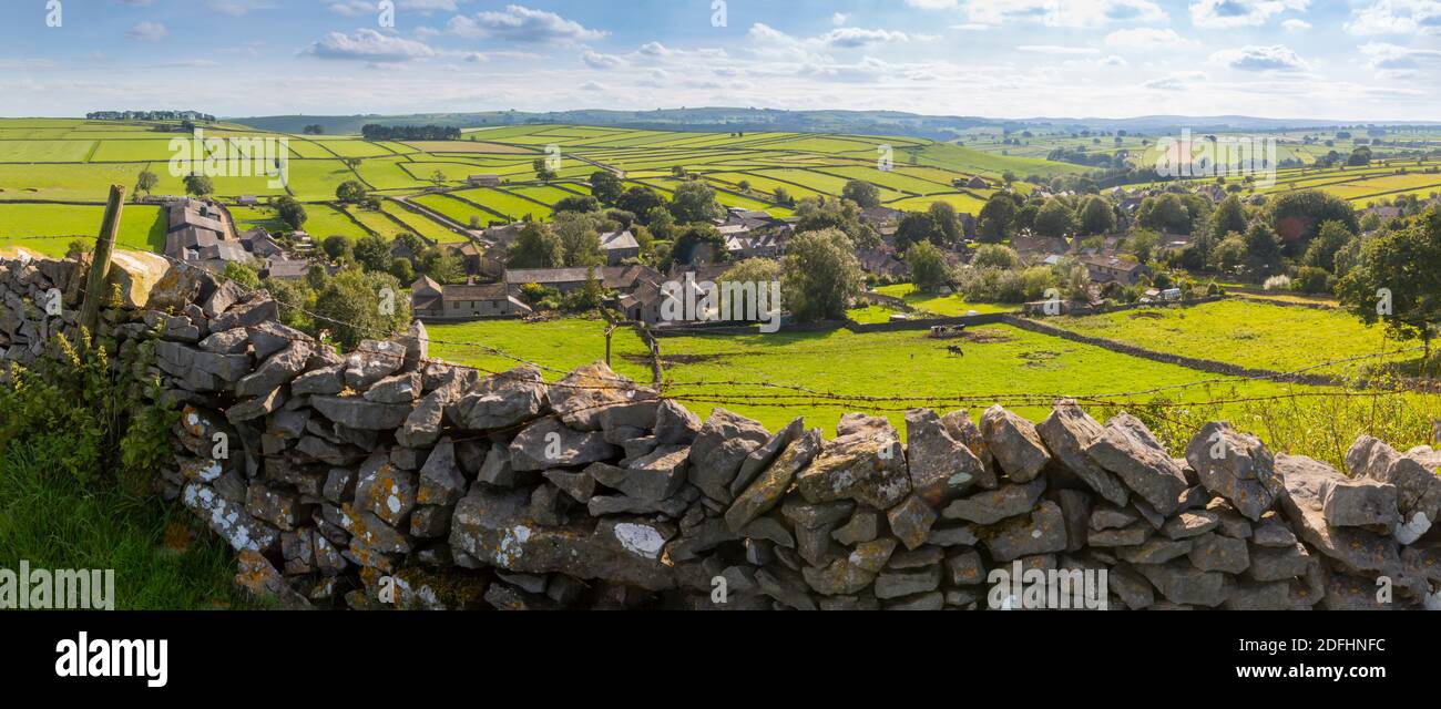 View of dry stone walls and Litton village, Peak District National Park ...