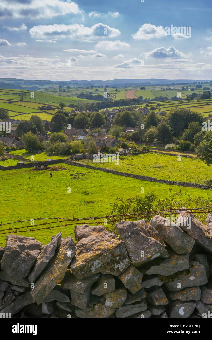 View of dry stone walls and Litton village, Peak District National Park ...