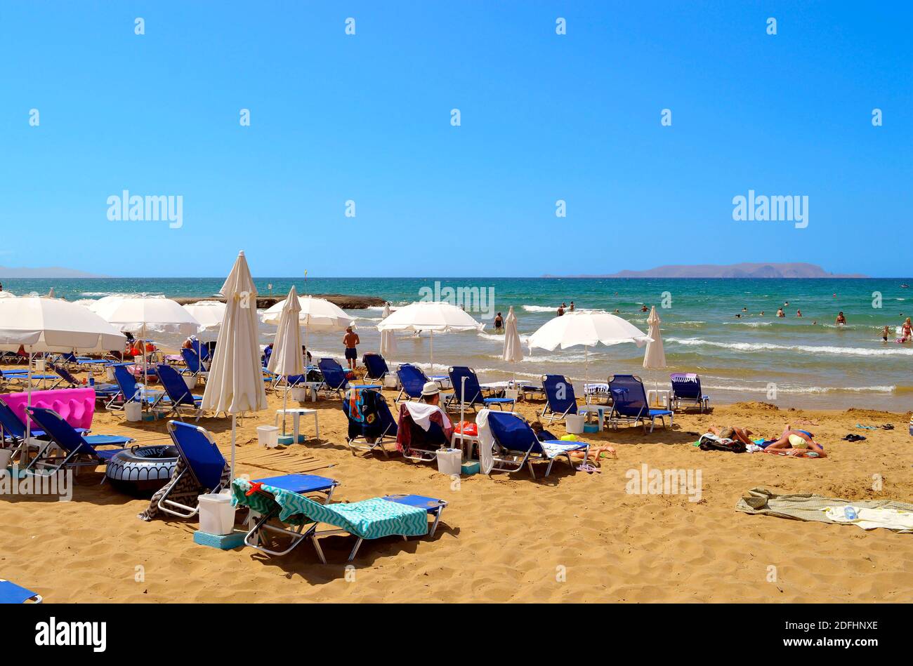 Tourists sunbathing on Gouves beach in Crete the largest and most ...