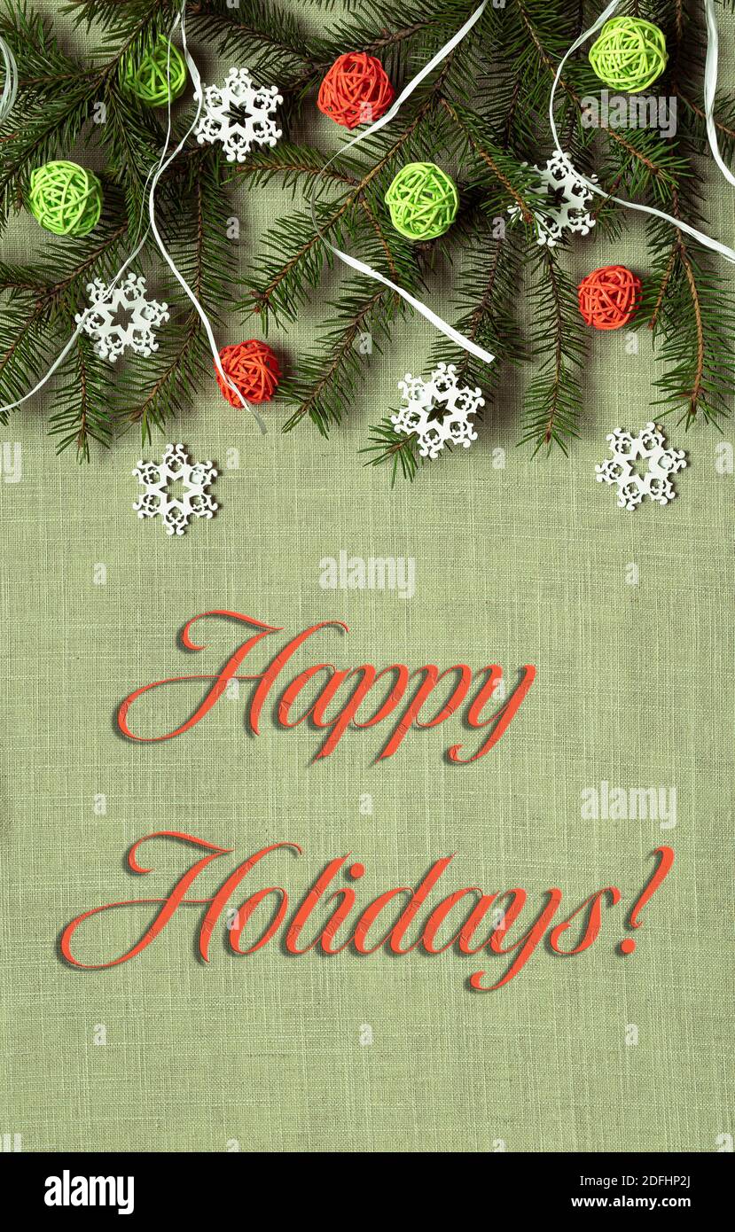 Fir, green and orange rattan balls and wooden snowflakes on green ...