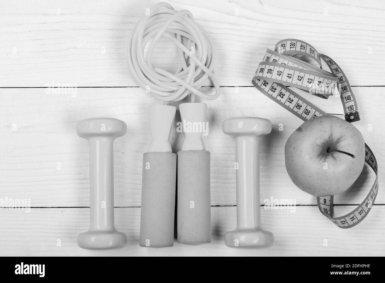 Workout and healthy lifestyle concept. Apple in green color near ...