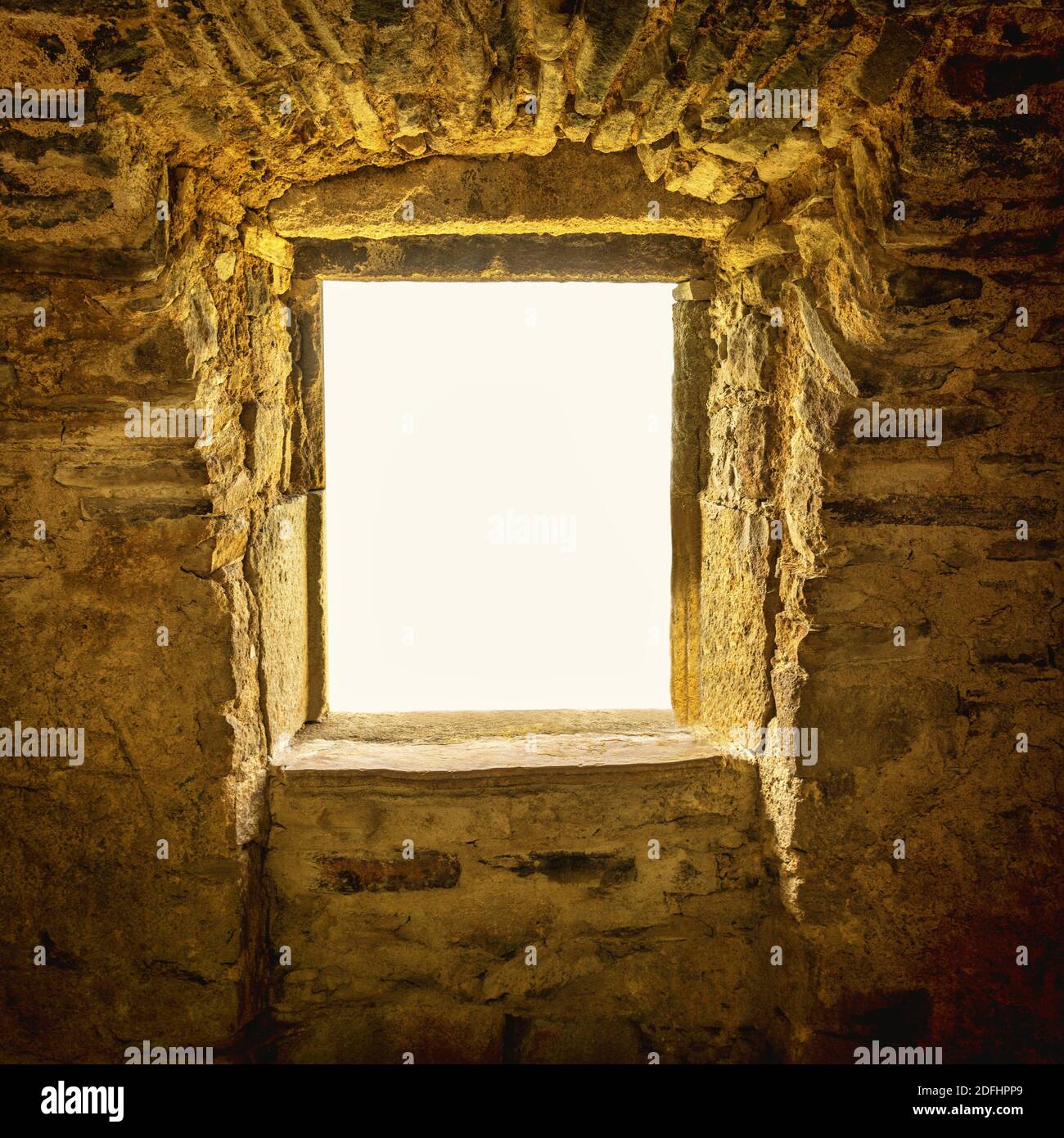 An old irregularly made stone wall with a bright window opening Stock ...