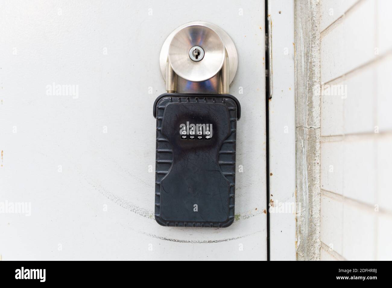 chain link fence and metal door with lock Stock Photo - Alamy