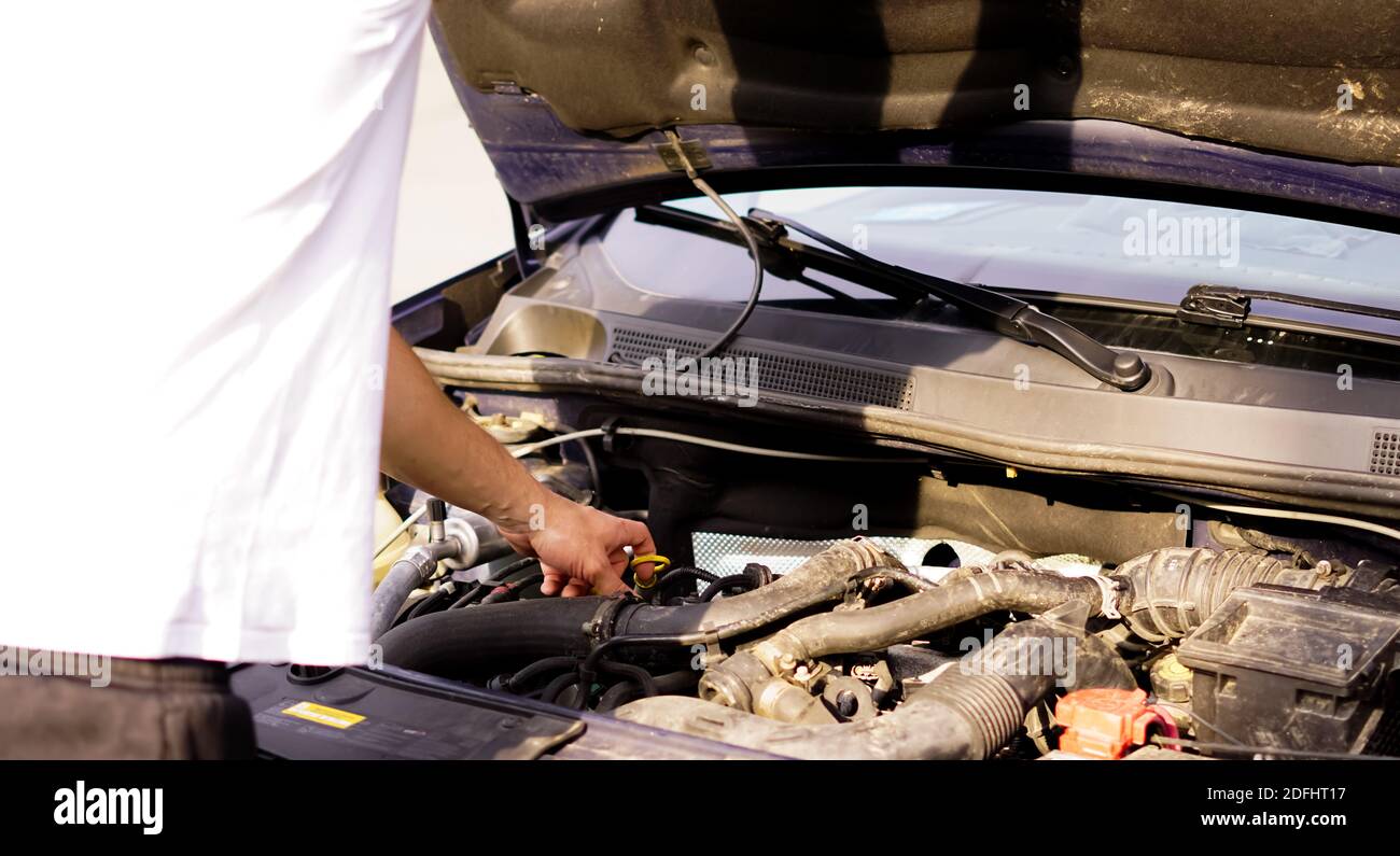repairman is checking the car engine Stock Photo - Alamy