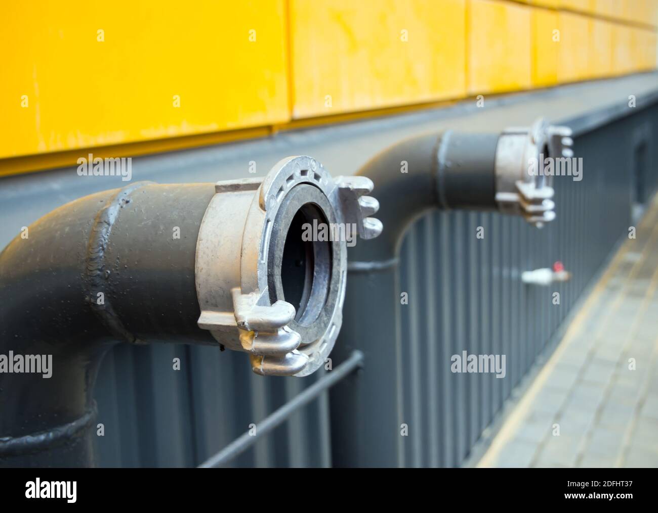 Fire hydrant pipes on the basement of the house Stock Photo - Alamy