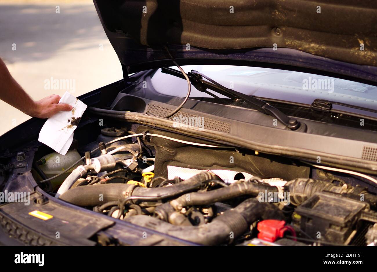 repairman is checking the car engine Stock Photo - Alamy