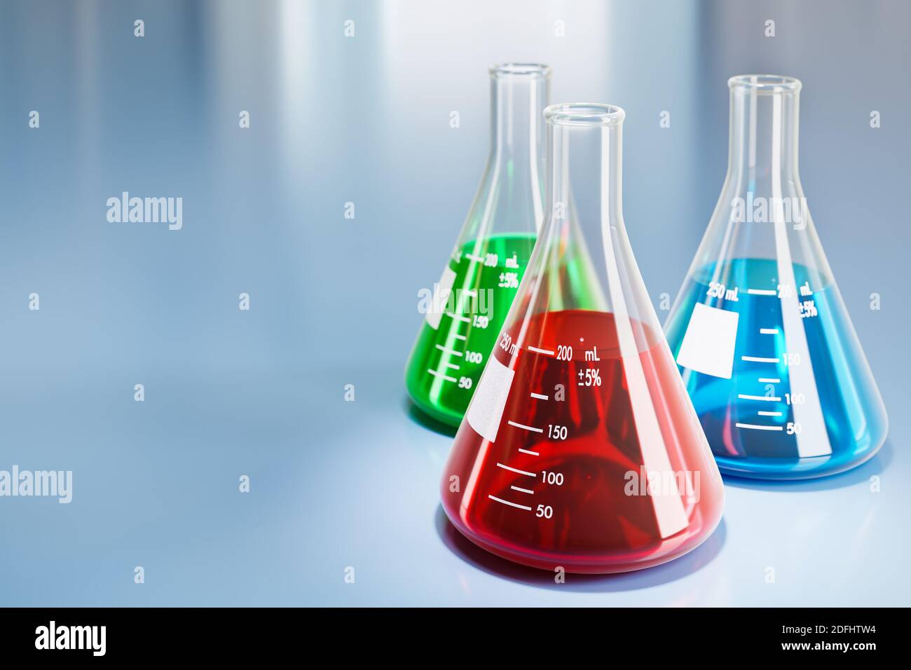 Erlenmeyer flasks with red, blue and green liquid in a laboratory Stock ...