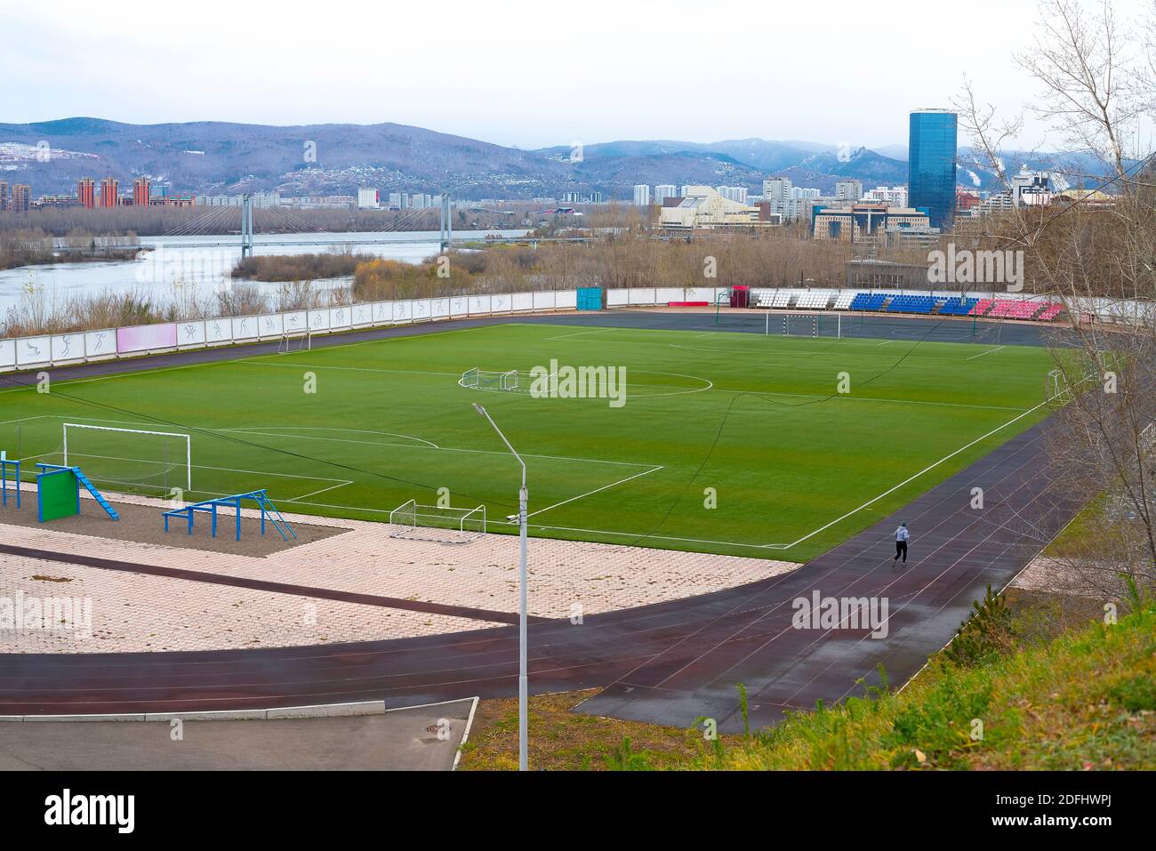 Training green soccer stadium with running track. Student training ...
