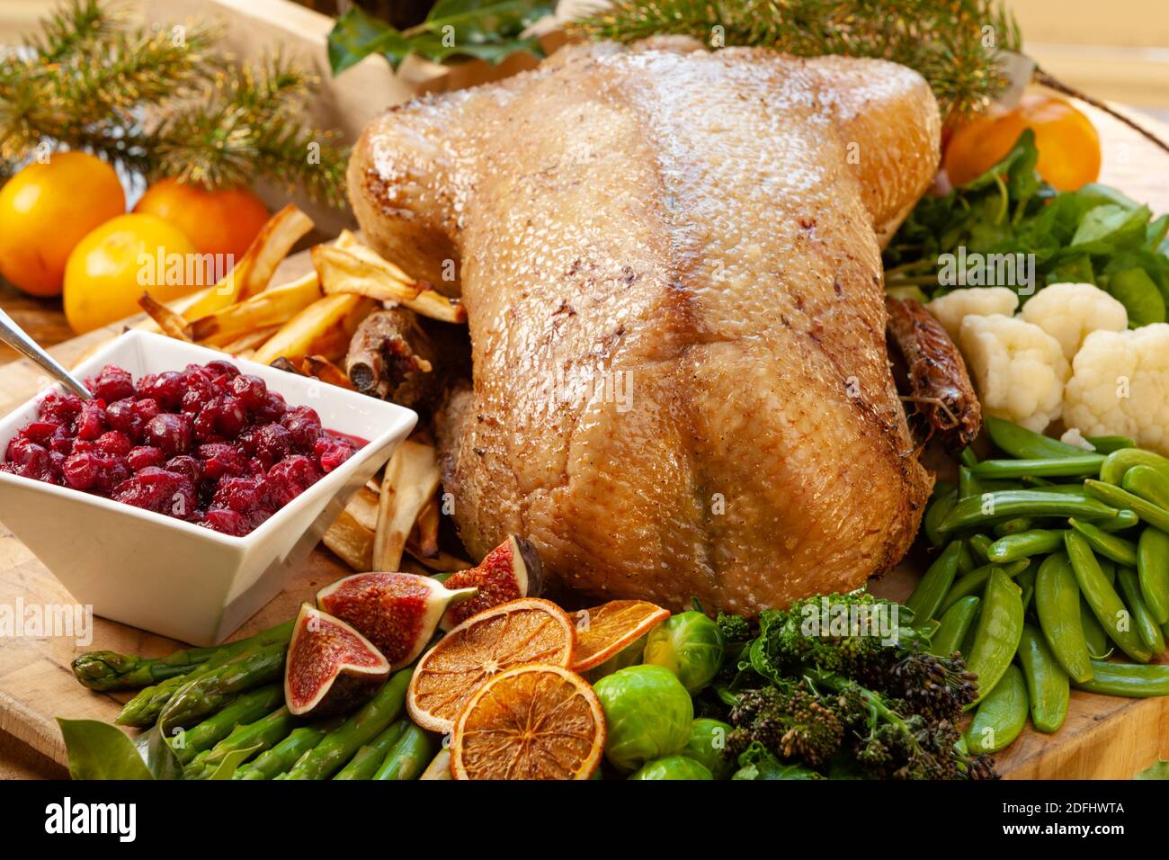 Traditional cooked goose Christmas dinner with fruit, vegetables and ...