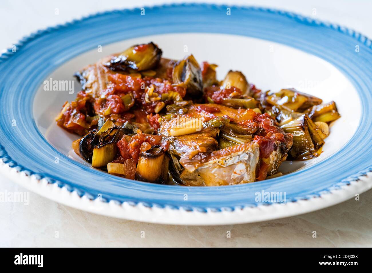 Bonito Fish Pieces with Tomato Sauce and Leek in Plate Baked in Oven ...