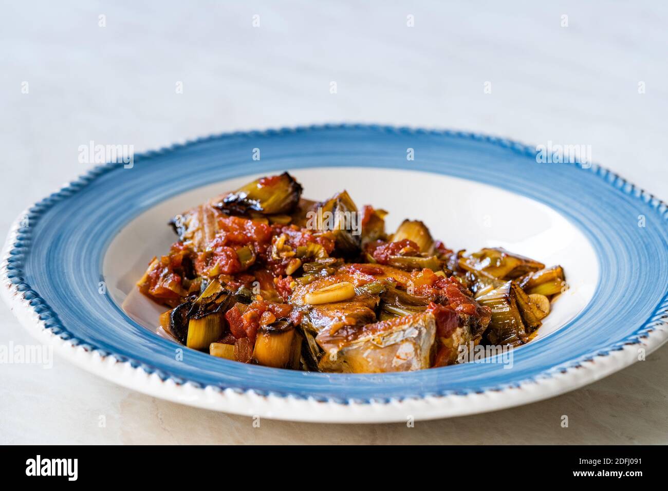 Bonito Fish Pieces with Tomato Sauce and Leek in Plate Baked in Oven ...